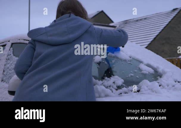 Woman scraping snow Stock Videos & Footage - HD and 4K Video Clips - Alamy