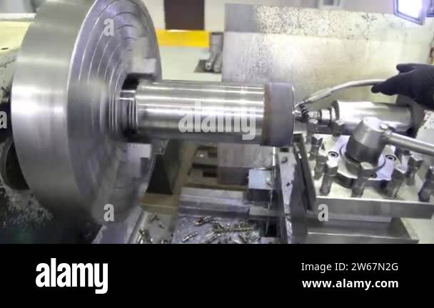 Drilling a metal workpiece using a lathe. The operation of lathe ...