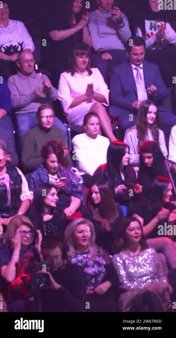 People viewers in a TV studio while recording a TV show. Vertical video ...