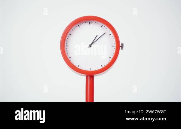 Round clock with white dial With handles and orange edges Black clock ...