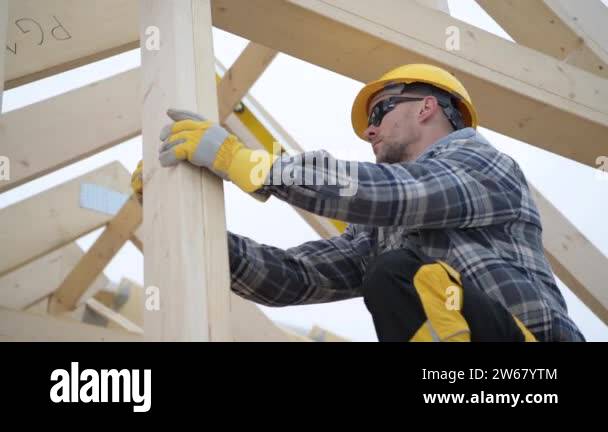 Construction Worker Checking Wooden Beams Levels with Spirit Tool ...
