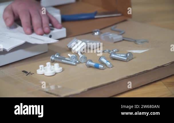 DIY white table assembly process at home. Furniture installation. New ...