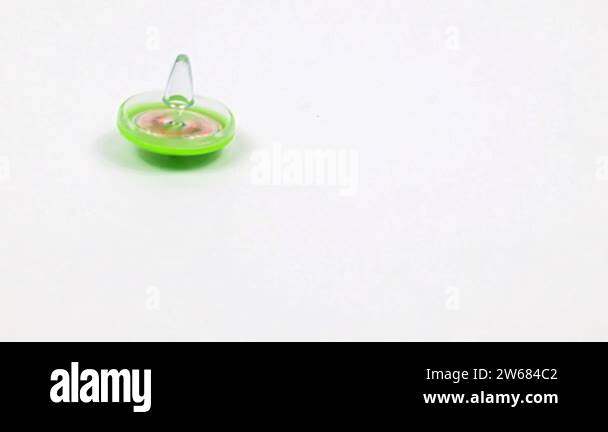 children's toy plastic spinning top whirligig spinning as a symbol of ...