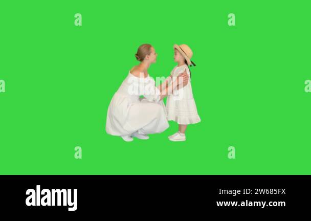 Mother and daughter talking with each other on a Green Screen, Chroma ...