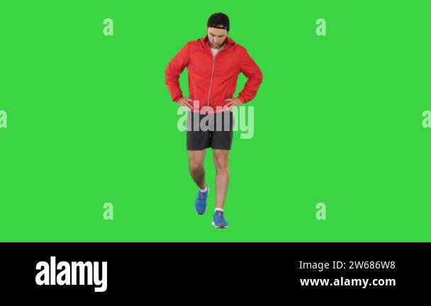 Sportsman having a heart attack on a Green Screen, Chroma Key Stock ...