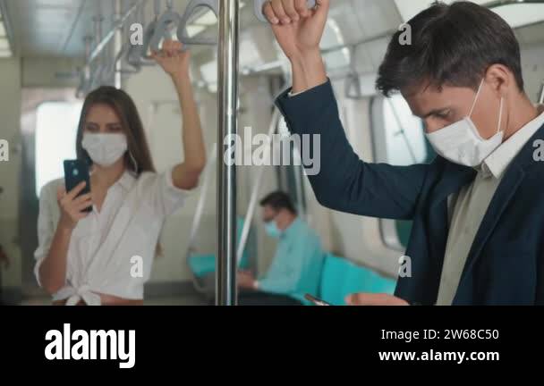 Close up businessman standing on the seat using modern smartphone to ...