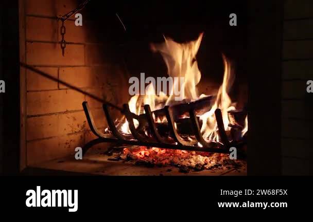 Fireplace in the house. Fire in fireplace, firewood burns in a ...