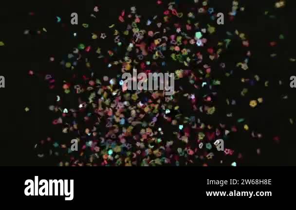 Close up Confetti explosion on black background. Slow Motion confetti ...