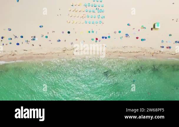 People relaxing, tanning, swimming in clear ocean water, Vacation ...