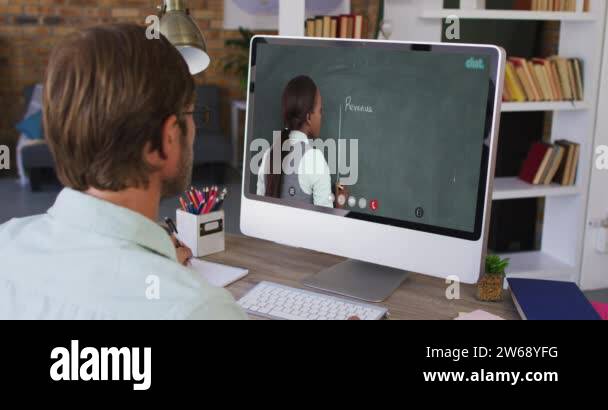 Caucasian male student using computer on video call with female teacher ...