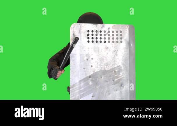 Riot police pushing forward with shield and baton up on a Green Screen ...