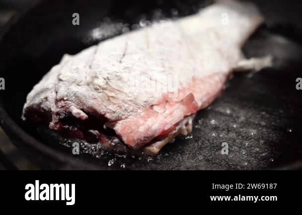 Carp fish is fried in a pan. Freshwater fish crucian carp. Recipe ...