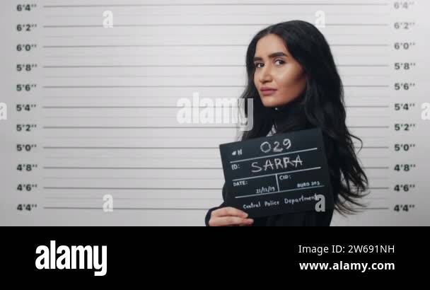 Side profile mugshot of mixed race woman with wavy hair turning head ...