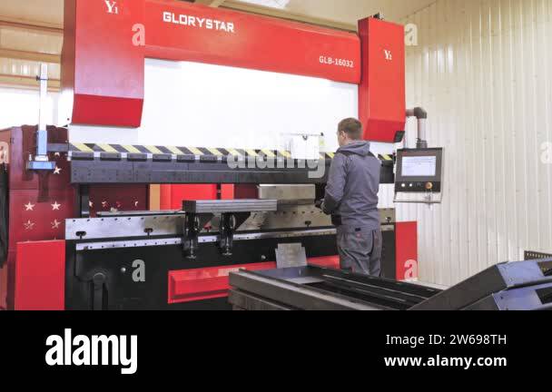 bending of sheet metal. A bending machine operator places and bens ...