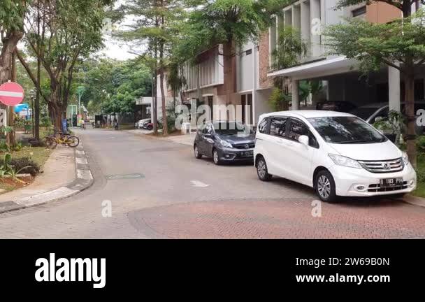 A typical modern middle class Indonesian gated housing complex in the ...