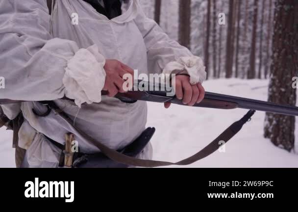 Reloading weapons on winter hunt. Hunting cartridges. Barreled gun ...
