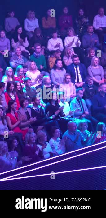 People viewers in a TV studio while recording a TV show. Vertical video ...