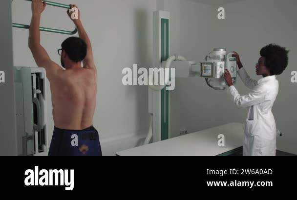 In the Hospital, Man Standing Face Against the Wall While Medical ...