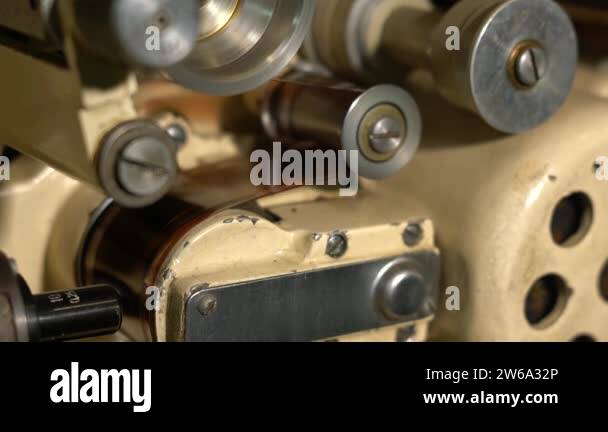 The rollers in the film mechanism rotate rapidly, rewinding the film ...