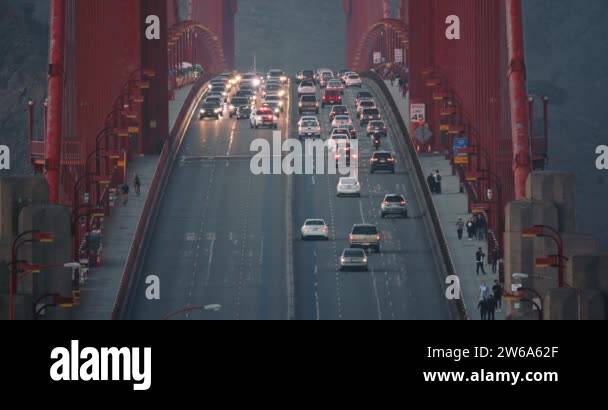 The police car with flashing lights is closing lanes on Golden Gate ...