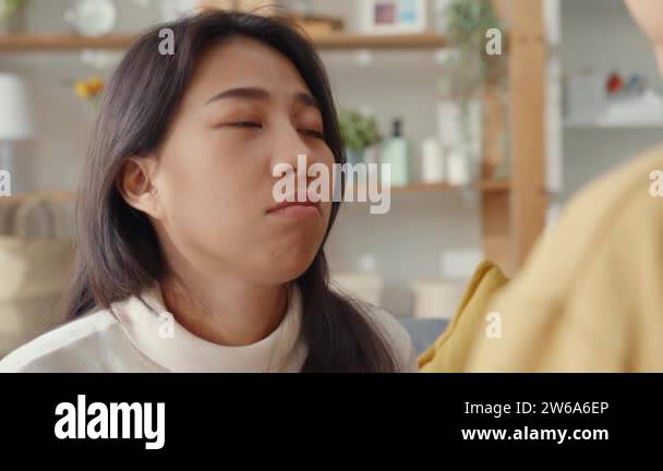 Sad young asian woman hug cuddle embracing with best friend in living ...