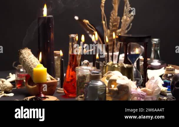Witch ritual table arranged with witch craft magic items. Selective ...
