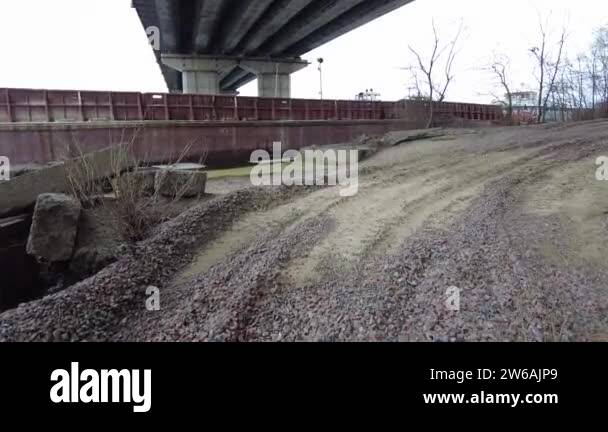 under the big bridge. Powerful iron bridge structure, View from below.A ...