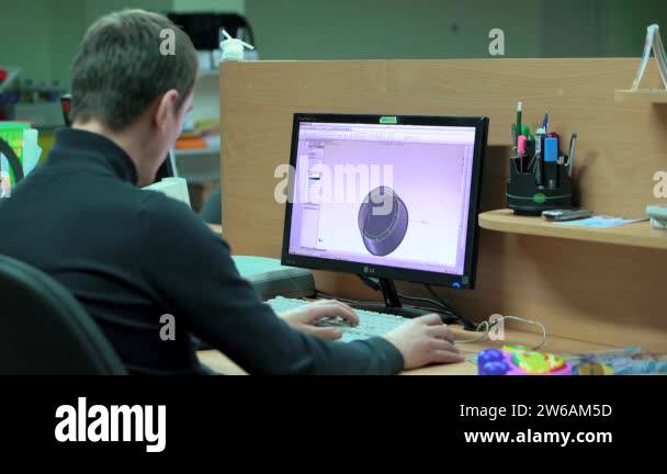 Man a Draftsman Verifies Blueprints with 3d Model at Monitor Screen ...