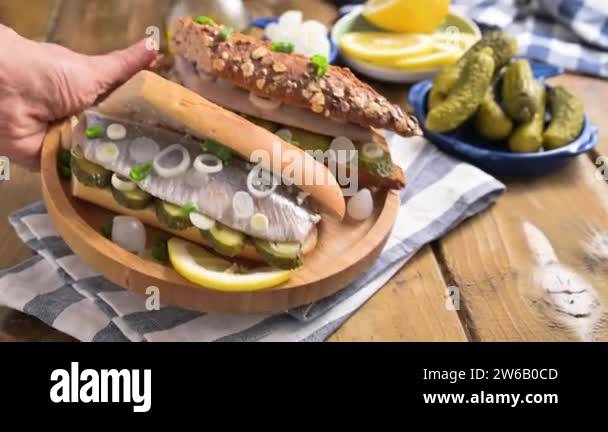 Dutch herring. Toast with Dutch herring, onions, pickles. Traditional ...
