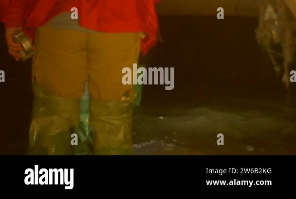 River Becomes Deeper Men Are Wading Through Water in a Cave Ceiling ...