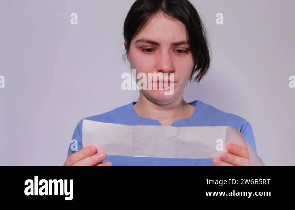 The Cardiologist Shows The Film Of An Electrocardiogram Of A Patient