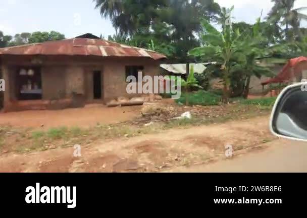 Driving Past Slums and Villages with Dilapidated Houses among Palm ...