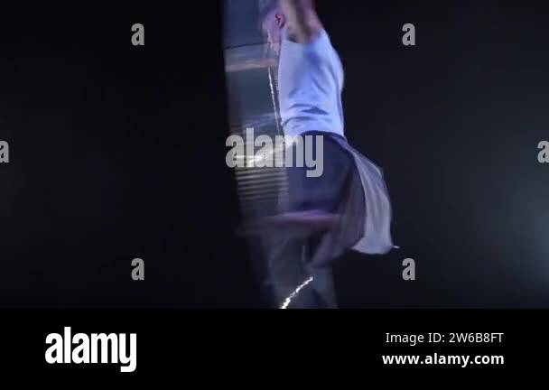 Circus artist shows concentration and balance while spinning on a Cyr ...