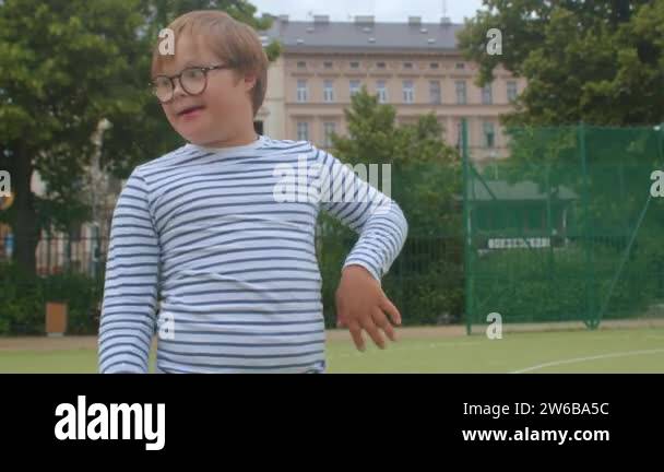 Down syndrome boy physically active hands. Expression emotions through ...