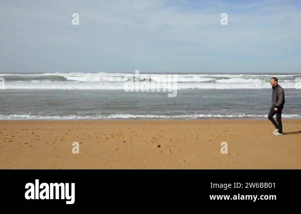 Single man walking along sandy Stock Videos & Footage - HD and 4K Video ...