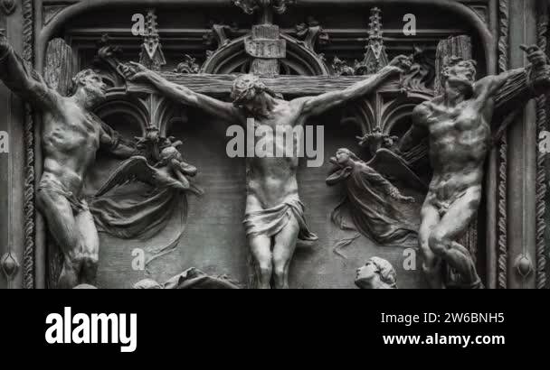 Statues of crusified Jesus and two criminal bandits filmed in close up ...