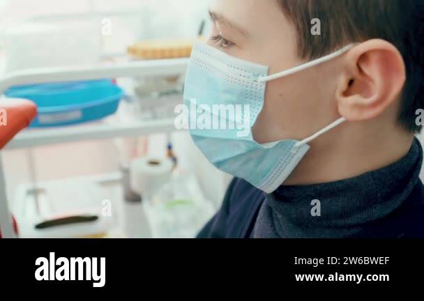 Boy patient and hospital female employee at laboratory room. Blood ...
