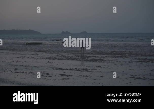 Ocean ebb theme in northern france in brittany region. Man tourist ...
