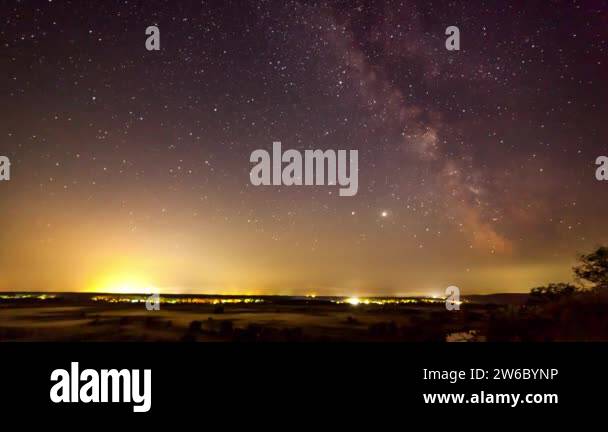 Starry night in mountains Time lapse. Milky way galaxy stars moving ...