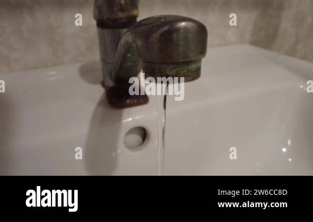 Water Runs From The Tap Water Running From Chrome Faucet Bathroom