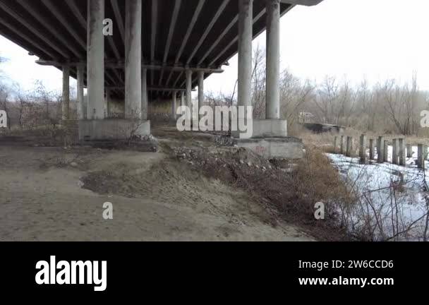 under the big bridge. Powerful iron bridge structure, View from below.A ...