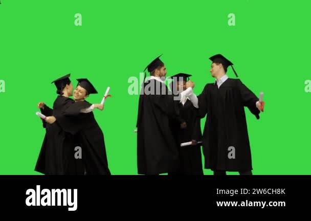 Happy students congratulating each other after the graduation ceremony ...