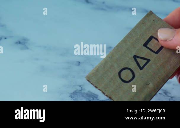 Kiev Ukraine - October 2021 Hand holding a squid game invitation card ...