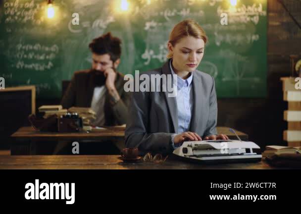 Secretary woman with typewriter. Young secretary woman using typewriter ...