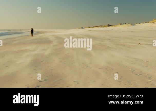 Arabian desert slow motion sand dunes blowing in the wind during a sand ...