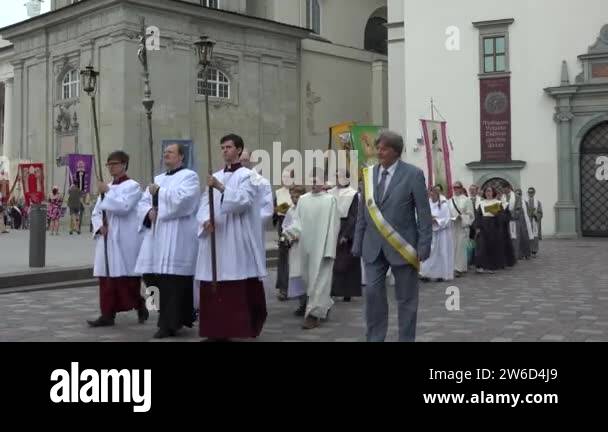 priests and monks carry flags and chant in religious procession. 4K ...
