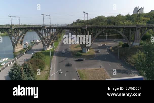 The road along the embankment. Cars travel along the embankment of a ...