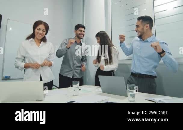 Excited motivated successful diversity colleagues joying and ...