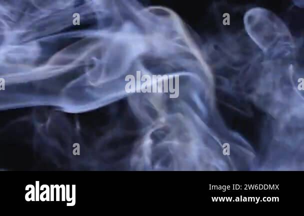 Clouds of white smoke float in space. Swirls of puffs of smoke flow ...