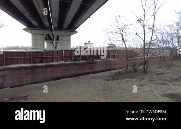 under the big bridge. Powerful iron bridge structure, View from below.A ...